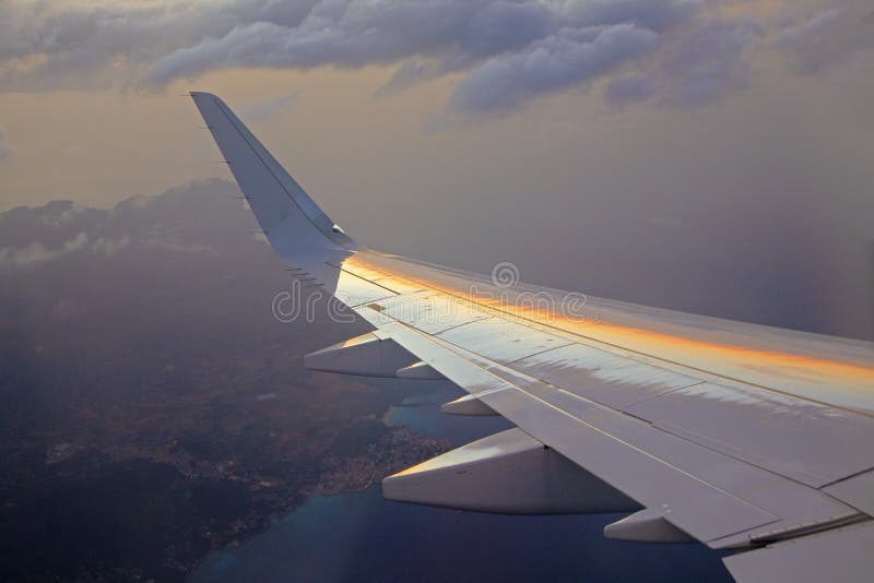 Sunset Seen from Aircraft with Reflection of Sun in Wing Stock Photo ...