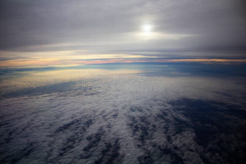 Sunset Seen from an Airplane with Clouds in the Foreground and in the ... Sunset Seen from an Airplane with Clouds in the Foreground and in the ...