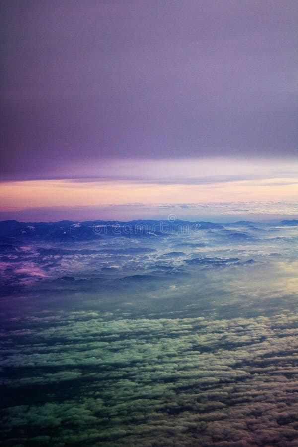 Sunset Seen from an Airplane with Clouds in the Foreground and in the ... Sunset Seen from an Airplane with Clouds in the Foreground and in the ...