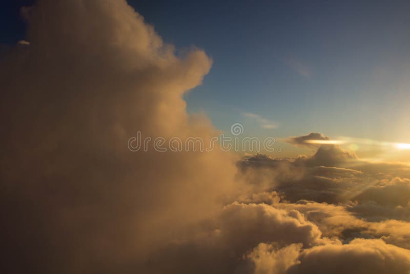 Sunset Seen from an Airplane with Clouds in the Foreground and in the ... Sunset Seen from an Airplane with Clouds in the Foreground and in the ...