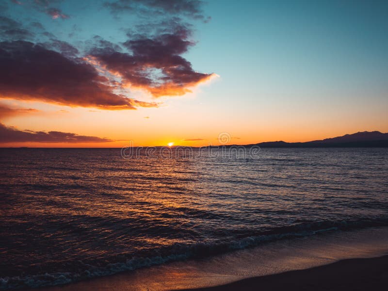 Sunset Seen from the Empty Beach - Mountains on the Horizon Stock Photo ...