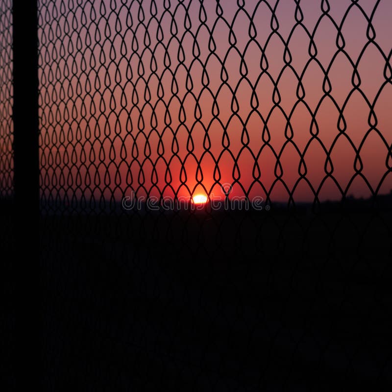 Sunset Seen through Net of a Fence Stock Image - Image of mesh, warm ...