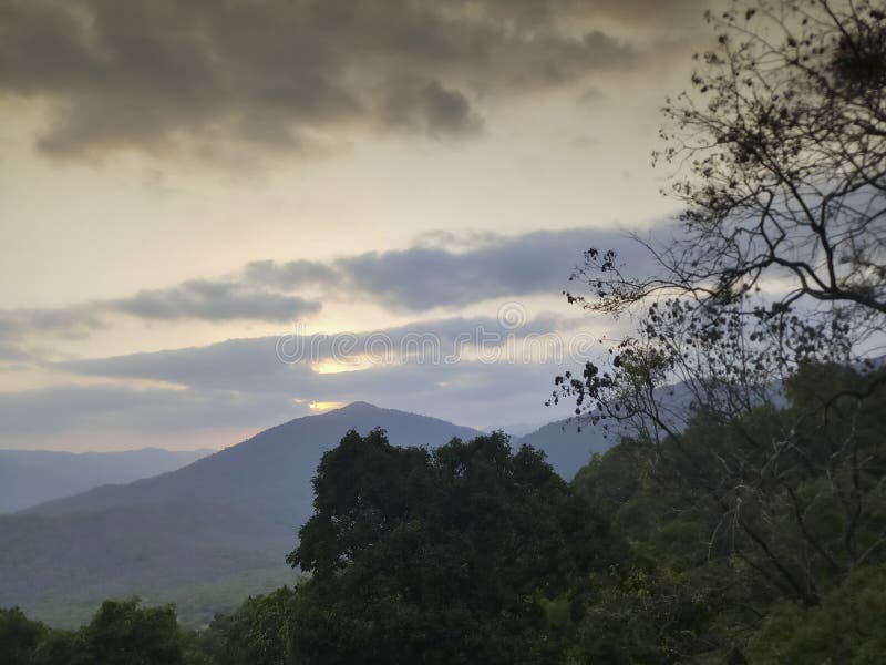 Sunset Seen from Viewpoint with Cloudy Sunset Sky, Distant Mountains in ...