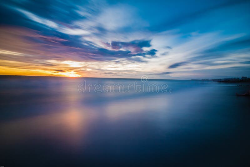 Sunset in Seminyak beach stock image. Image of bali - 139972961