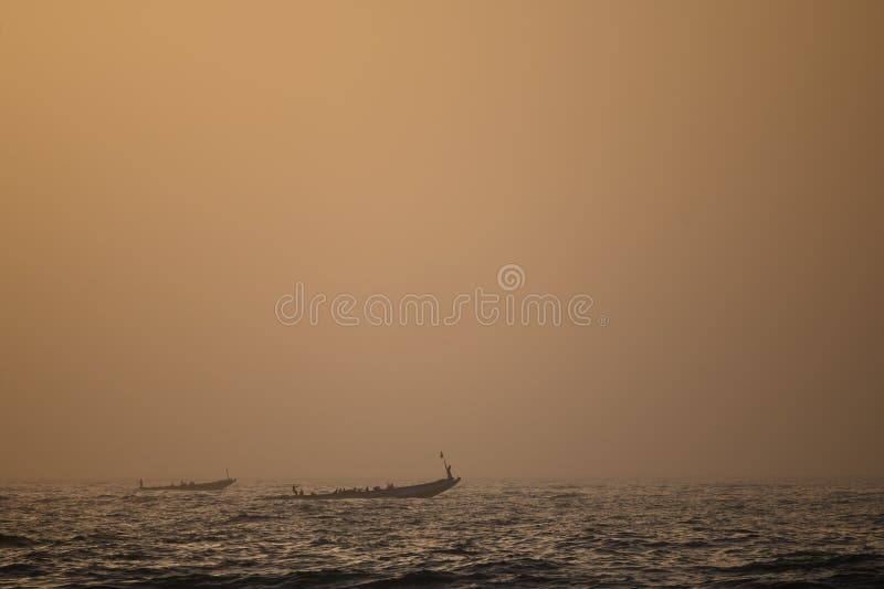 Sunset on the Senegalese Sea with Boats Stock Photo - Image of heaven ...