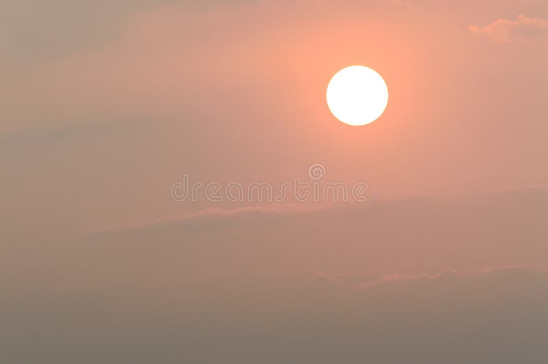 Sunset, the Setting Sun Over the Clouds on a Foggy Day Stock Photo ...
