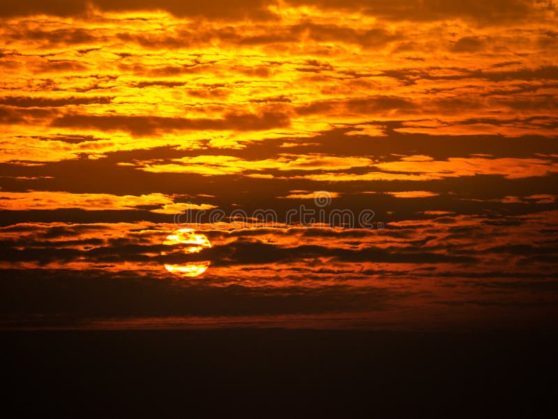 Sunset Shining Golden Light Behind the Fluffy Clouds Stock Photo ...