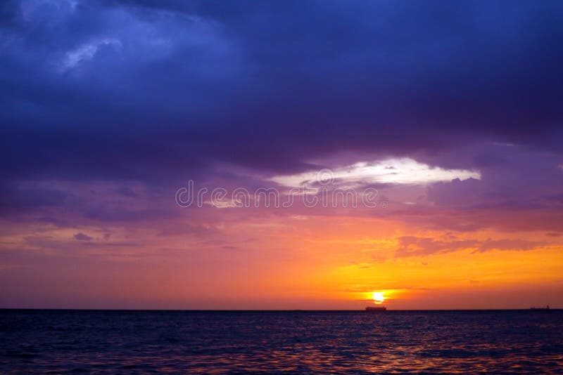 Sunset and Ship on Horizontal Ocean Water Surface Colorful Cloud Stock ...