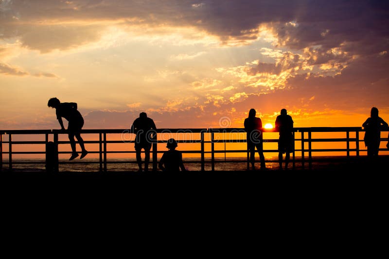 Sunset Silhouettes stock photo. Image of jetty, sunset - 62714998