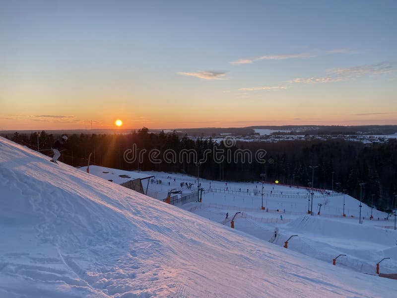 Sunset on the ski slope stock photo. Image of skier - 271280292