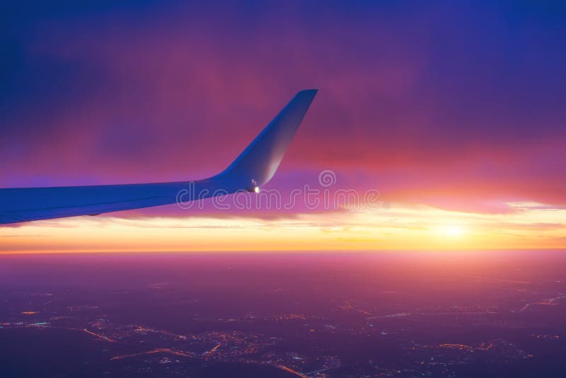 Sunset Sky from an Airplane Side Wing View of the Horizon and City ...