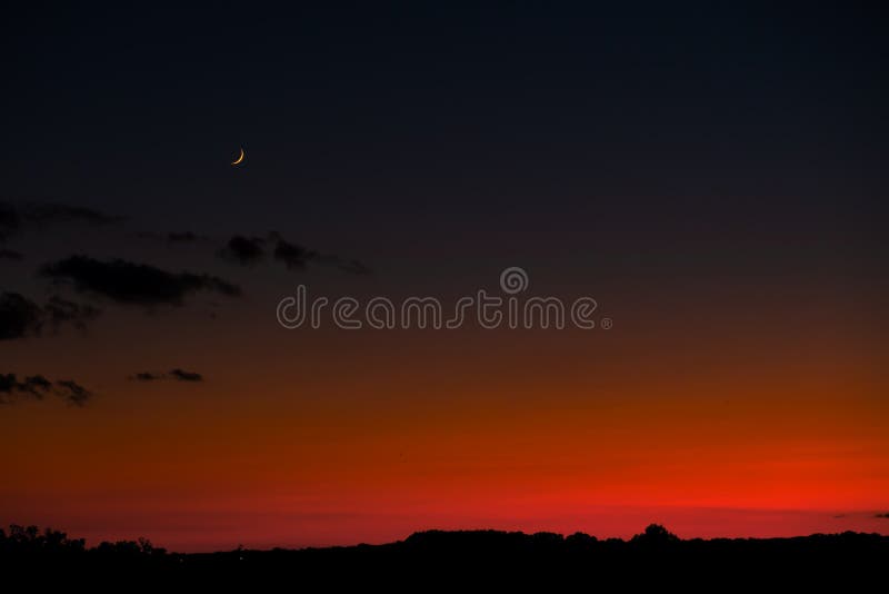 Sunset Sky with Bright Red Horizon and Crescent Moon Stock Photo ...