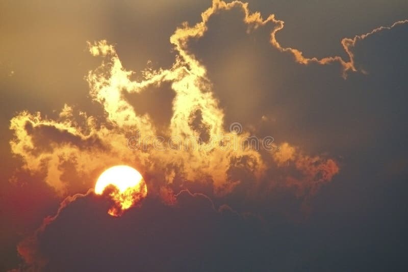 Sunset Sky with Clouds.clouds Partially Cover the Sun Stock Image ...