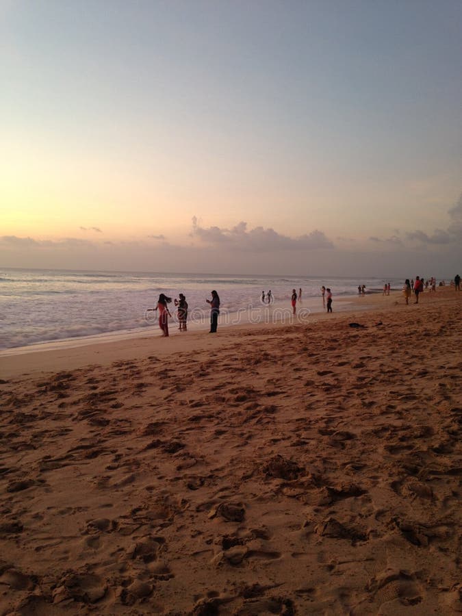 Beach stock photo. Image of clouds, beach, human, sunset - 207737738