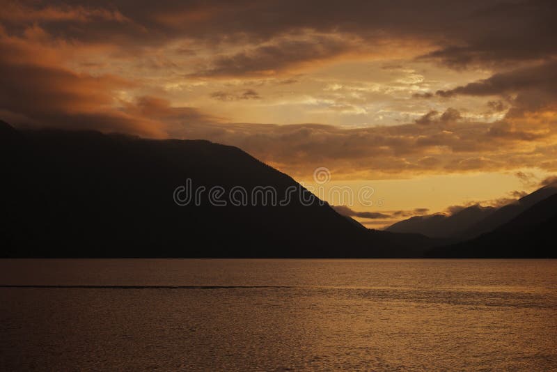 Sunset Sky Over the Lake stock image. Image of silhouettes - 28943277