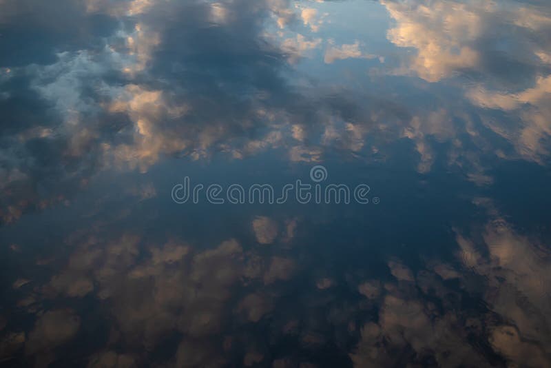 Sunset Sky Reflected in Water. Pink Clouds and Blue Sky Reflection in Still Lake Stock Photo ...