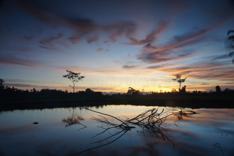 Sunset sky reflection lake stock image. Image of dawn - 221094365