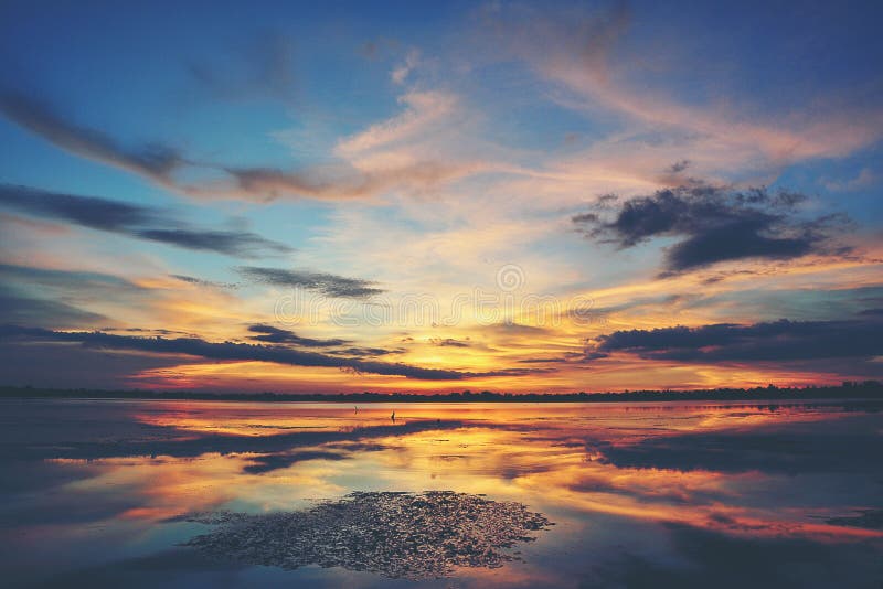 The Sunset Sky and the Reflection on the Water. Stock Photo - Image of ...