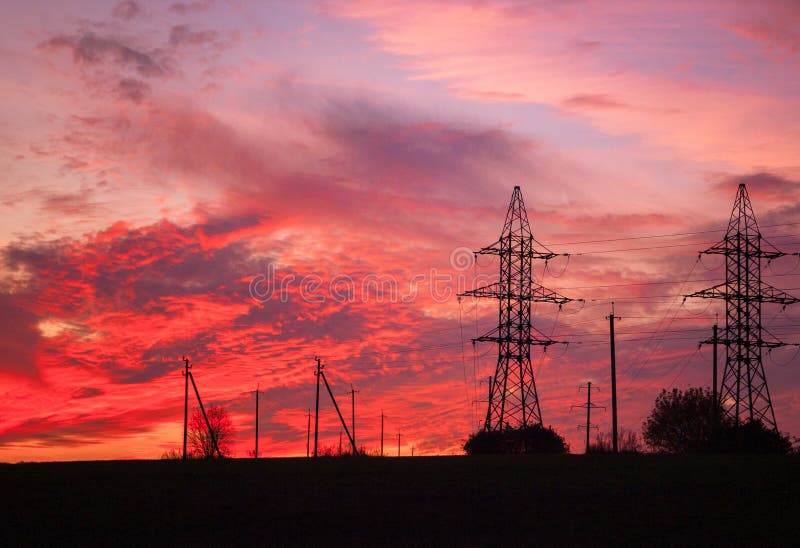 Sunset in the Sky Setting Sun with Electric Lines Towers Stock Photo ...