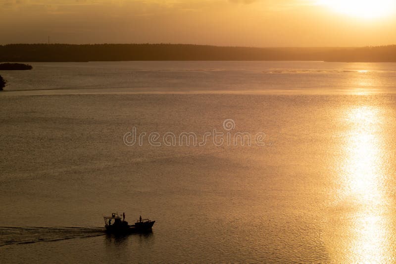 During Sunset, a Small Barge Navigates the Lake Stock Image - Image of ...