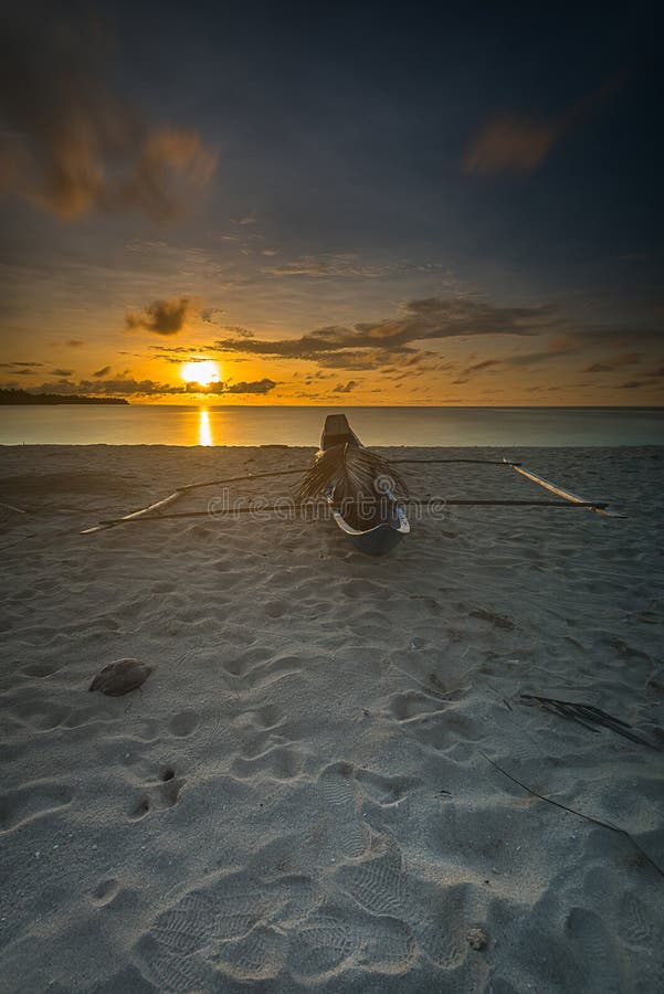 Sunset and small boat stock image. Image of horizon - 182215721