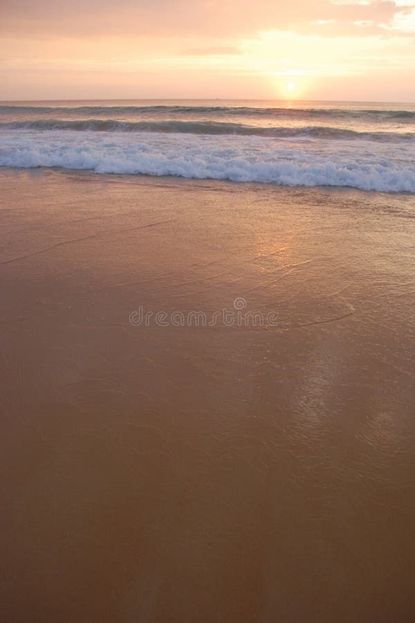 Sunset on the Smooth Sandy Beach with Gentle Waves Stock Image - Image ...