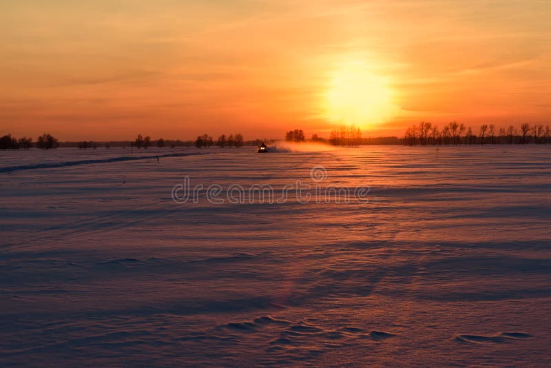 Sunset snow field sun sky stock image. Image of fiery - 65856623