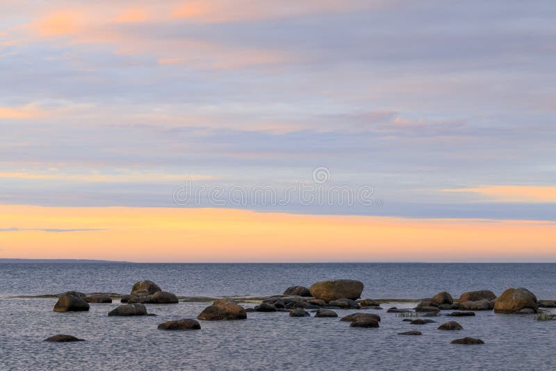 Sunset at stoney seashore stock photo. Image of nature - 95790656