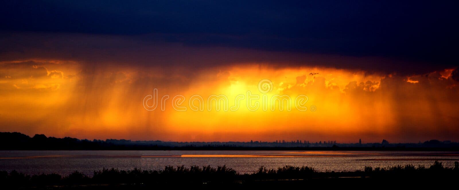 A sunset with storm stock image. Image of rocks, waves - 38818751