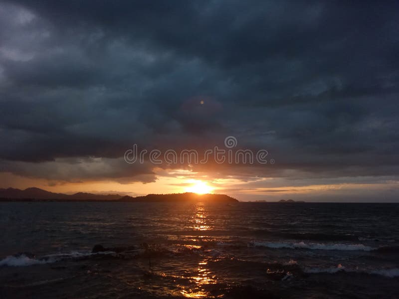 Sunset with Storm Clouds Above Stock Photo - Image of reflection, dawn ...