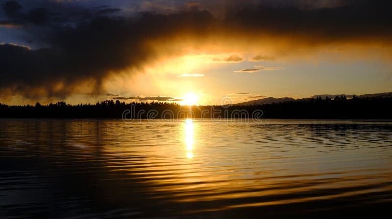Sunset Storm Clouds Over Lake Pine Trees Wilderness Stock Photo - Image ...