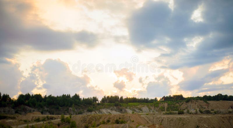 Sunset with Storm Clouds Over a Quarry and Forest in Summer Stock Image ...
