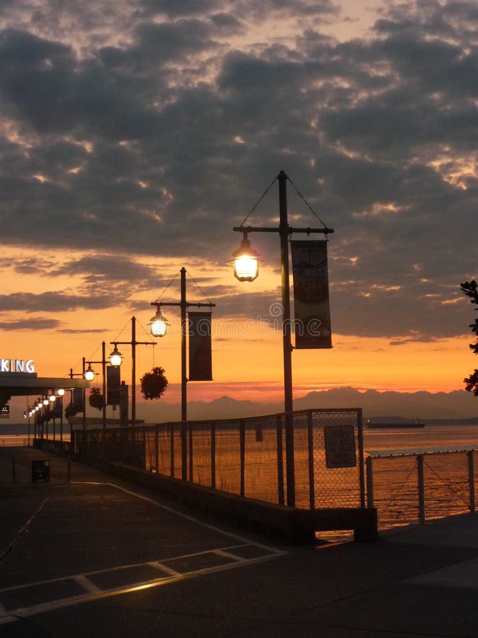 Sunset with street lamps stock image. Image of dusk, electricity - 12767661