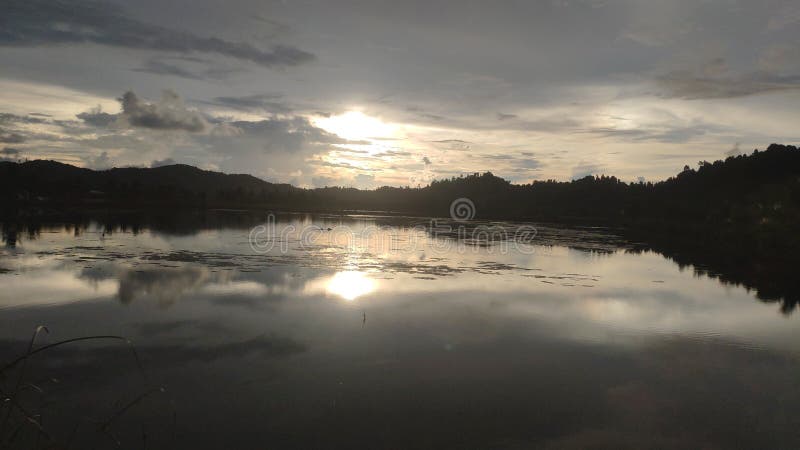 Sunset sun stock image. Image of sunlight, sunset, lake - 263047593