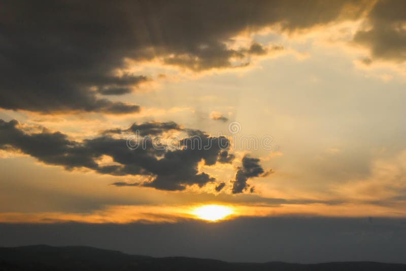 A Sunset with the Sun Rays Shining Stock Photo - Image of shining, rays ...
