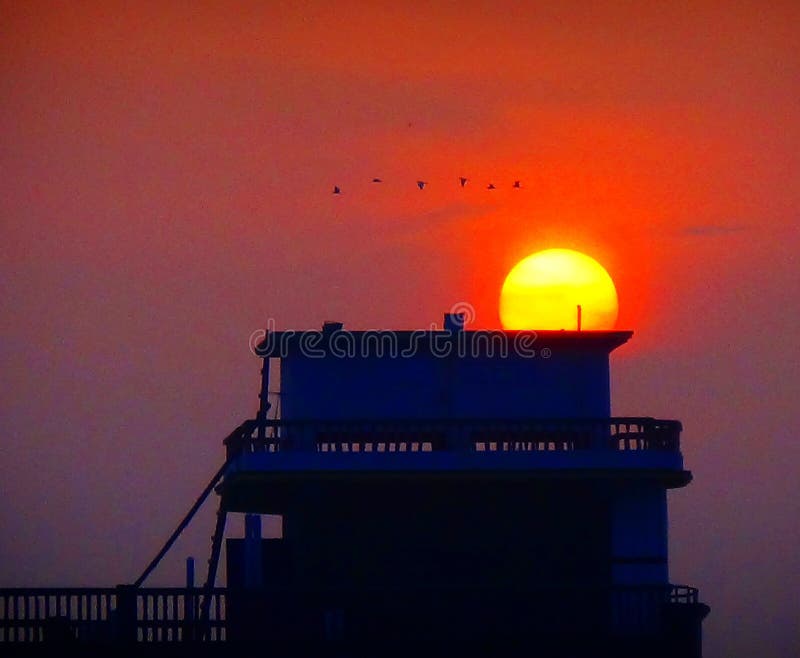 Sunset stock image. Image of sunset, setting, building - 125652465