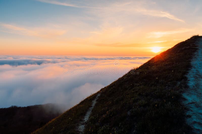 Sunset or Sunrise with Clouds on Mountains with Trails Stock Image ...