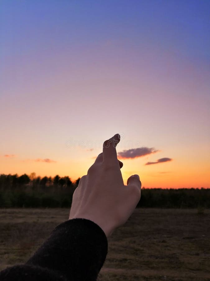 A Sunset stock image. Image of cool, nature, hand, sunset - 152389049