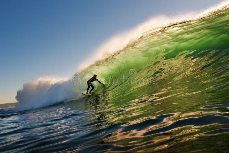 Surfer in the Tube at Sunset Stock Image - Image of blue, barrel: 7904725