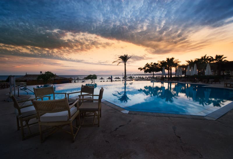 Sunset and swimming pool stock photo. Image of sand, paradise - 4164704