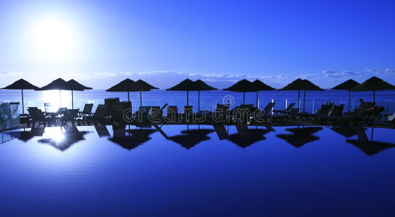 Sunset in a swimming pool stock photo. Image of holiday - 106917990