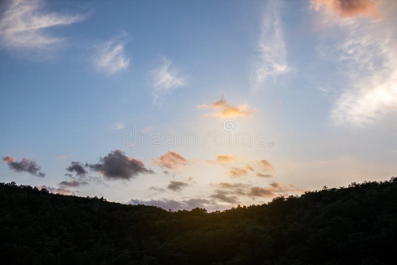 Sunset with Tiny Distant Clouds Above the Forest Stock Image - Image of ...