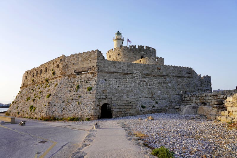 Sunset on Tower and Fort of Saint Nicholas, Rhodes, Greece Stock Photo ...