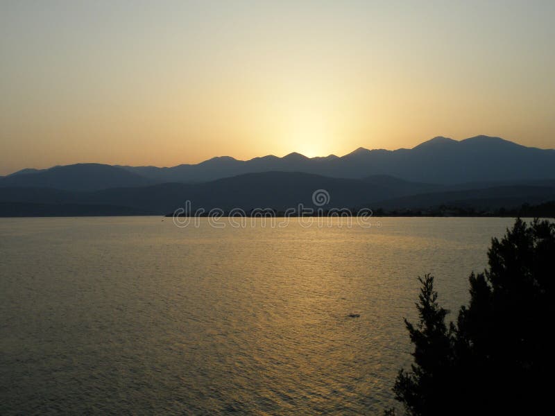 Sunset in Itea stock image. Image of itea, town, mountain - 103125033