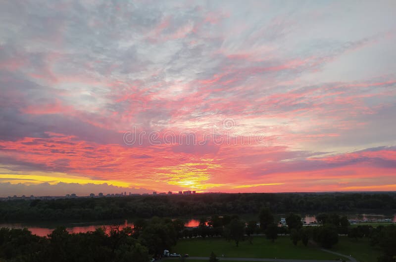Sunset in town stock image. Image of yellow, park, tree - 186593801