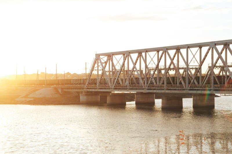 The Sunset Train Passes the Railway Bridge Stock Image - Image of ...