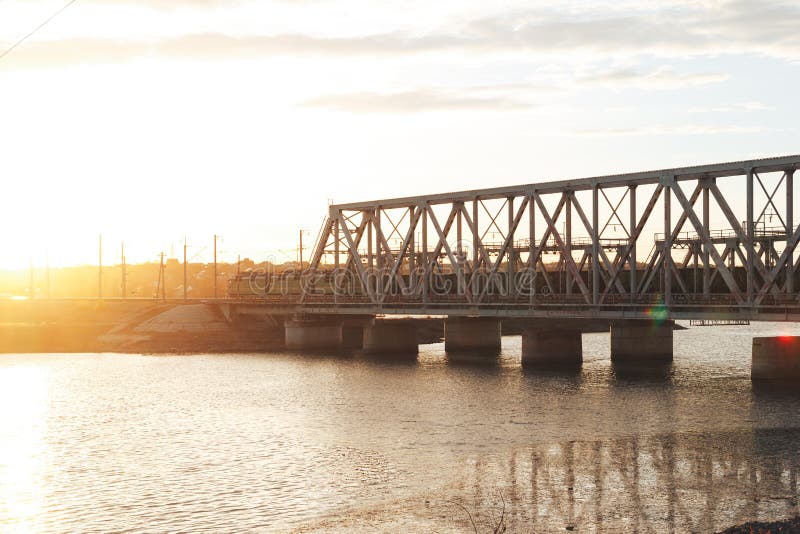 The Sunset Train Passes the Railway Bridge Stock Photo - Image of ...