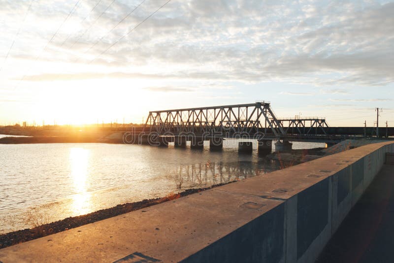 The Sunset Train Passes the Railway Bridge Stock Image - Image of ...