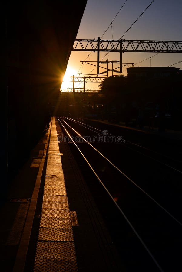 Sunset at train station stock photo. Image of sunset - 95068570
