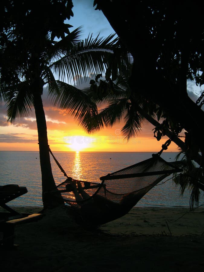 Sunset on a tropical beach stock image. Image of reflection - 11321799